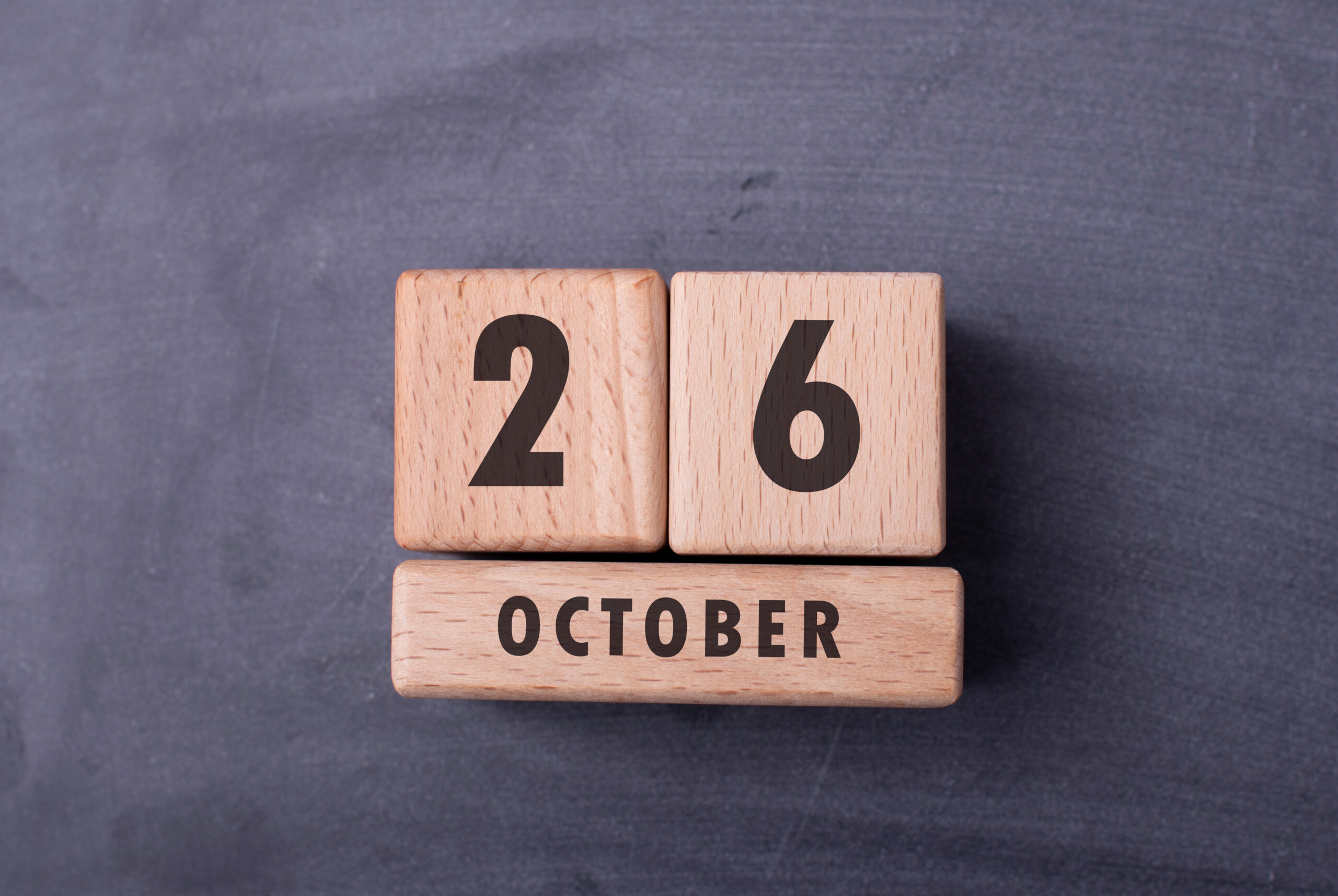 October 26 written with wooden blocks | TRANS.Biz